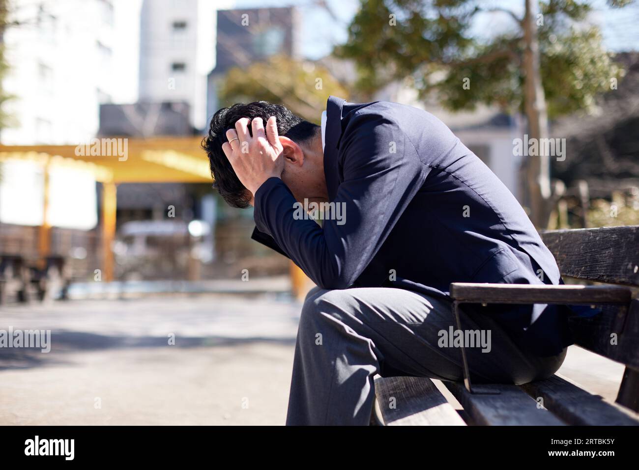 Stressed Japanese man Stock Photo - Alamy