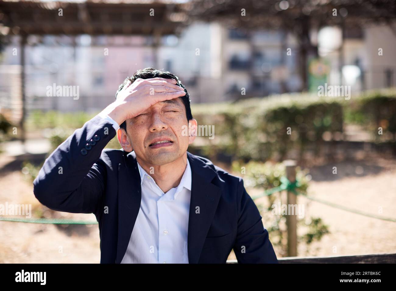 Stressed Japanese man Stock Photo - Alamy