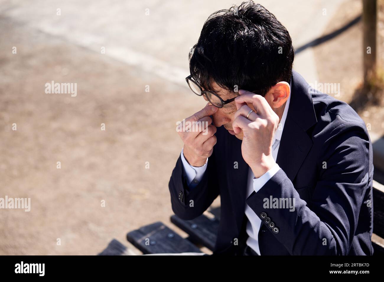 Stressed Japanese man Stock Photo - Alamy