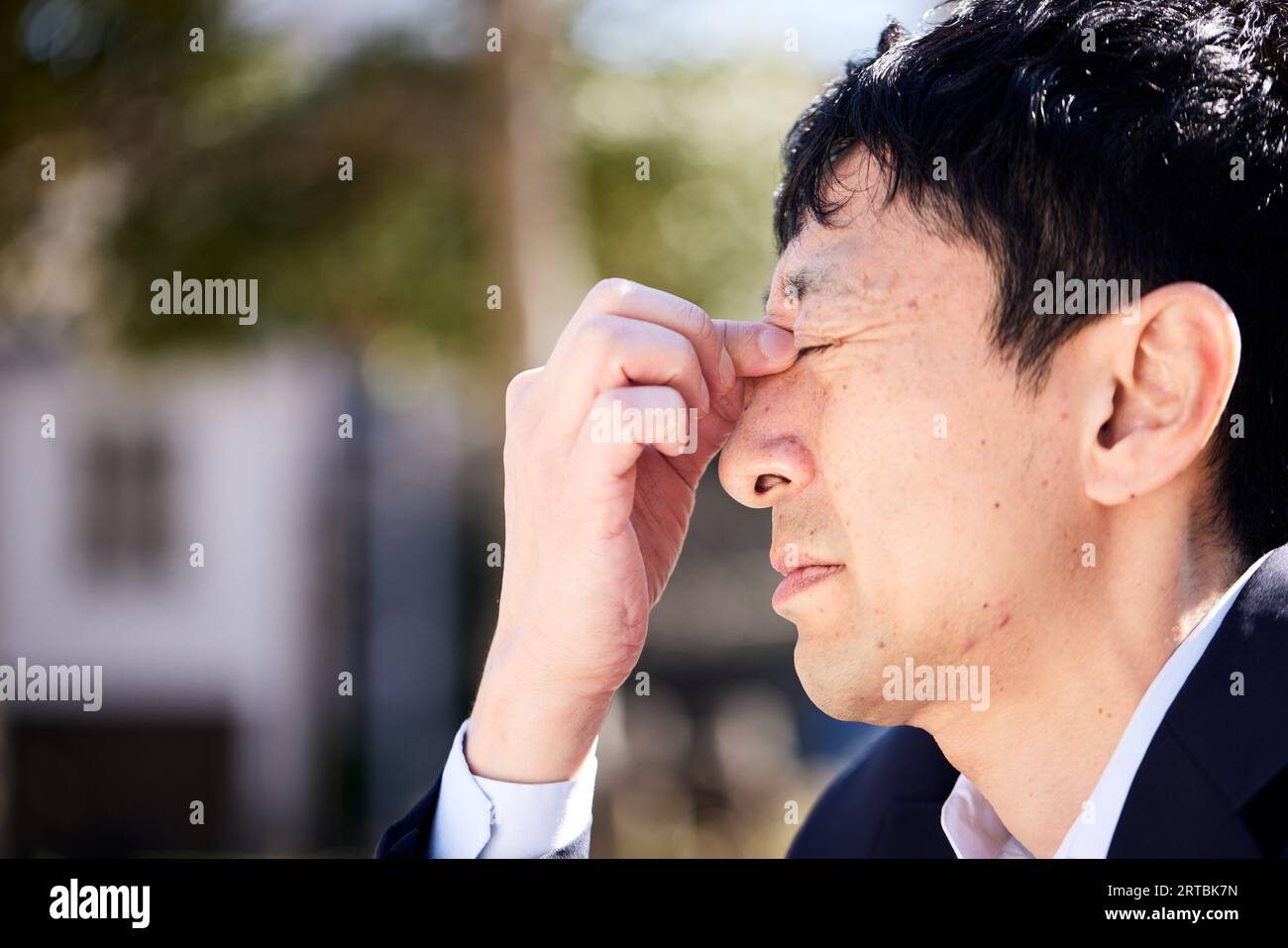Stressed Japanese man Stock Photo - Alamy
