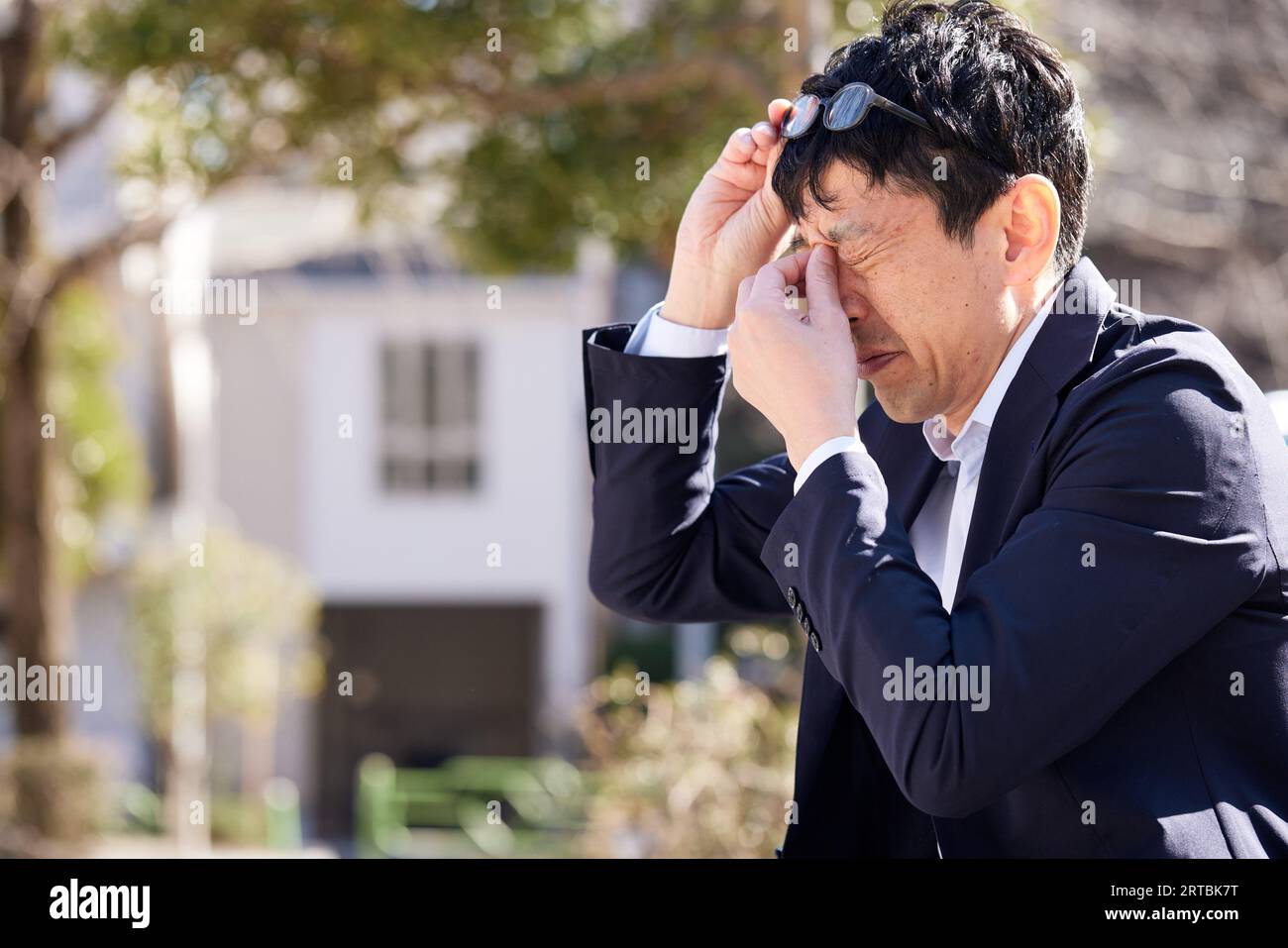 Stressed Japanese man Stock Photo - Alamy