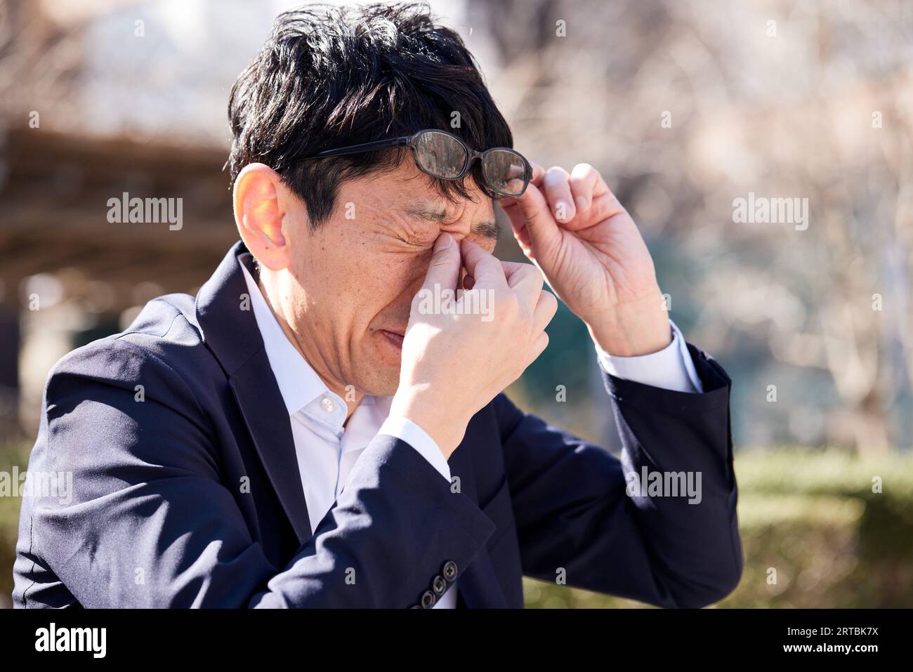 Stressed Japanese man Stock Photo - Alamy