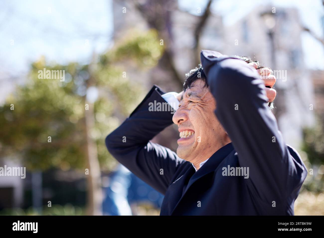 Stressed Japanese man Stock Photo - Alamy