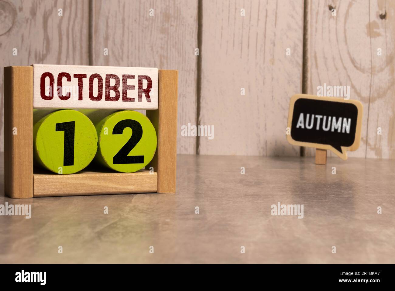 October calendar with number 12. Planner copy space on a wooden brown ...
