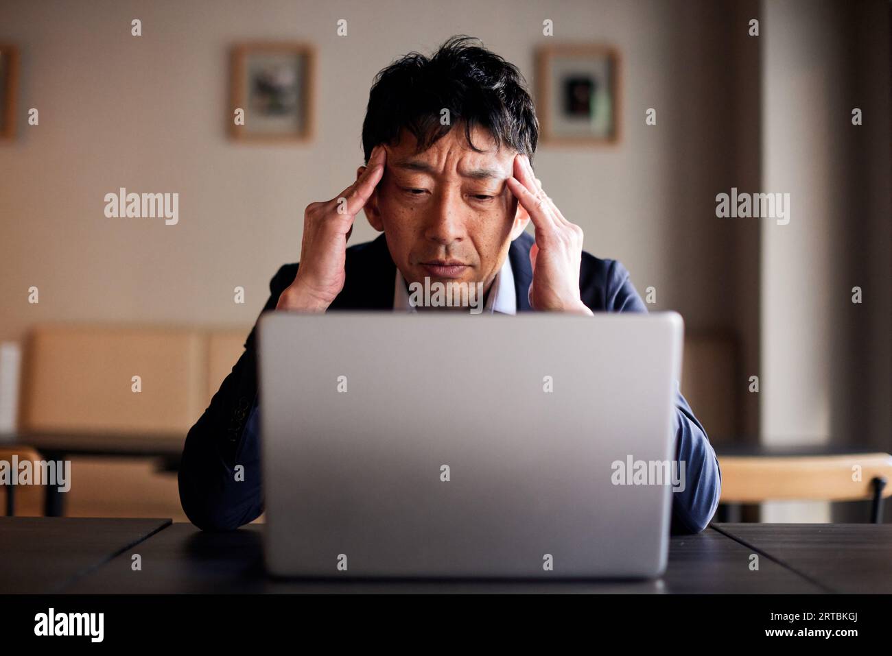 Stressed Japanese man Stock Photo - Alamy