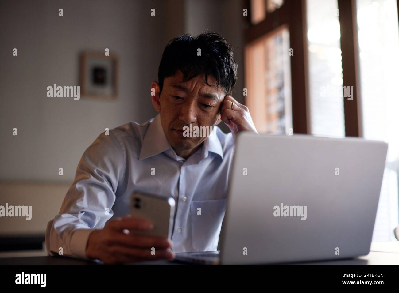 Stressed Japanese man Stock Photo - Alamy