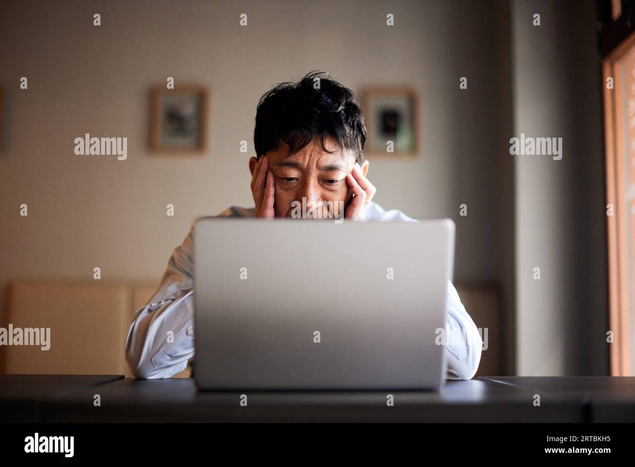Stressed Japanese man Stock Photo - Alamy