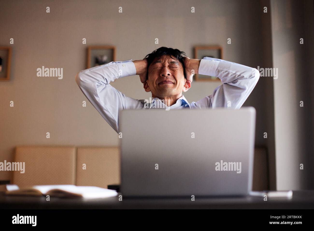Stressed Japanese man Stock Photo - Alamy