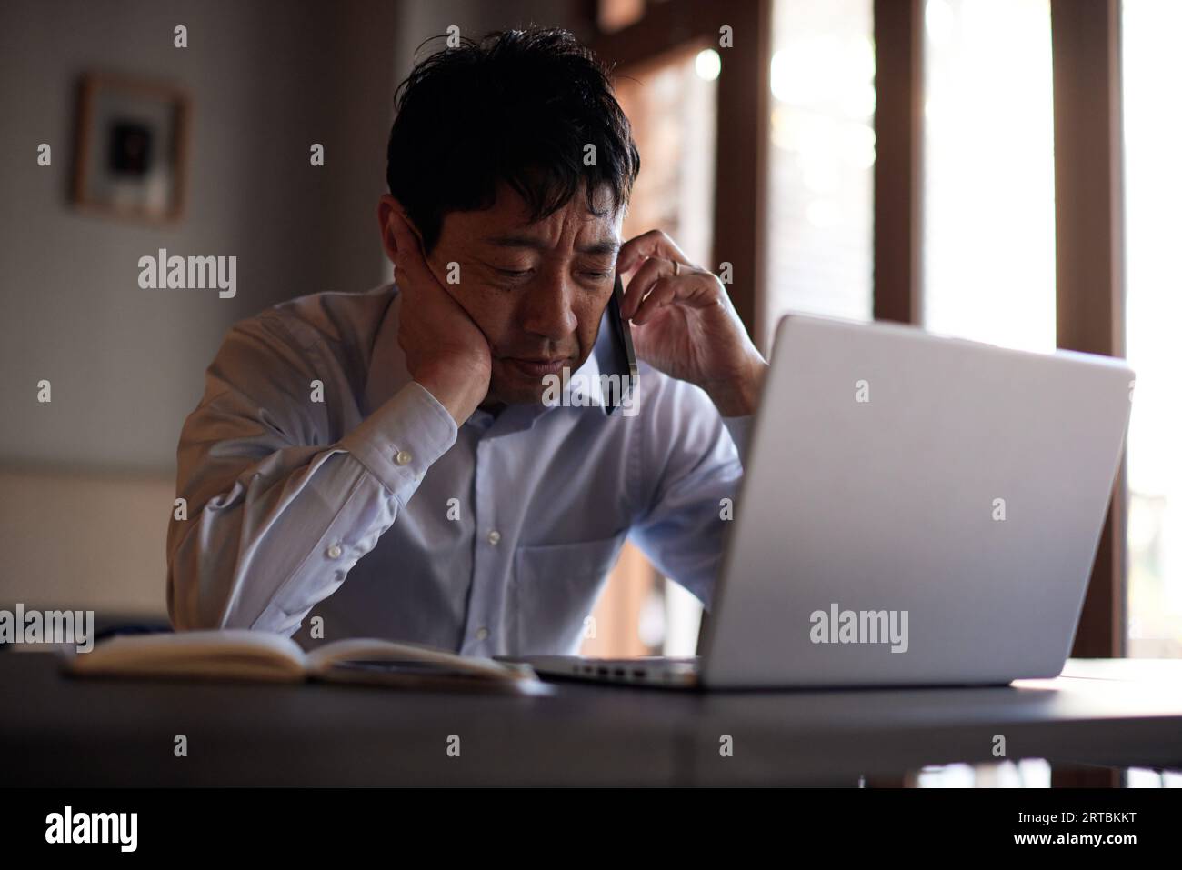 Stressed Japanese man Stock Photo - Alamy