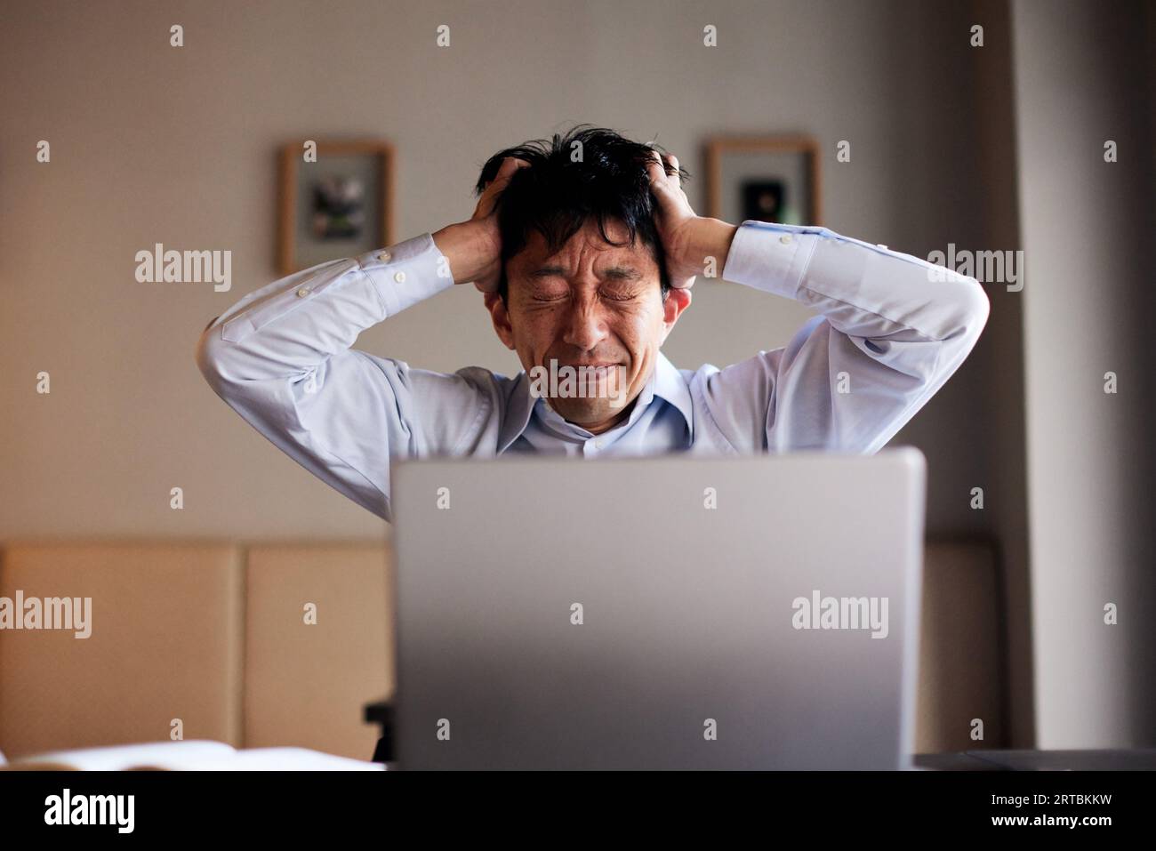 Stressed Japanese man Stock Photo - Alamy
