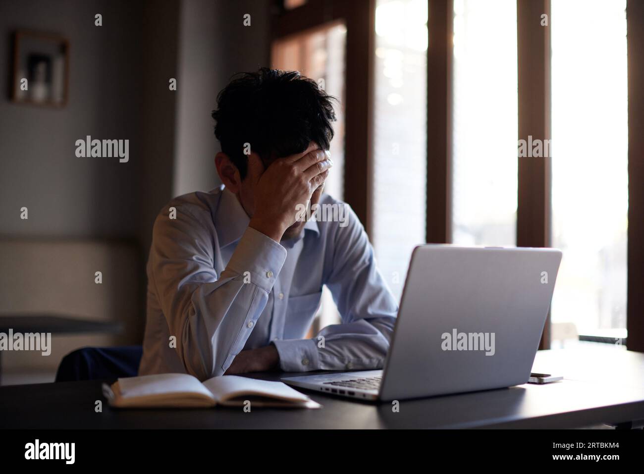 Stressed Japanese man Stock Photo - Alamy