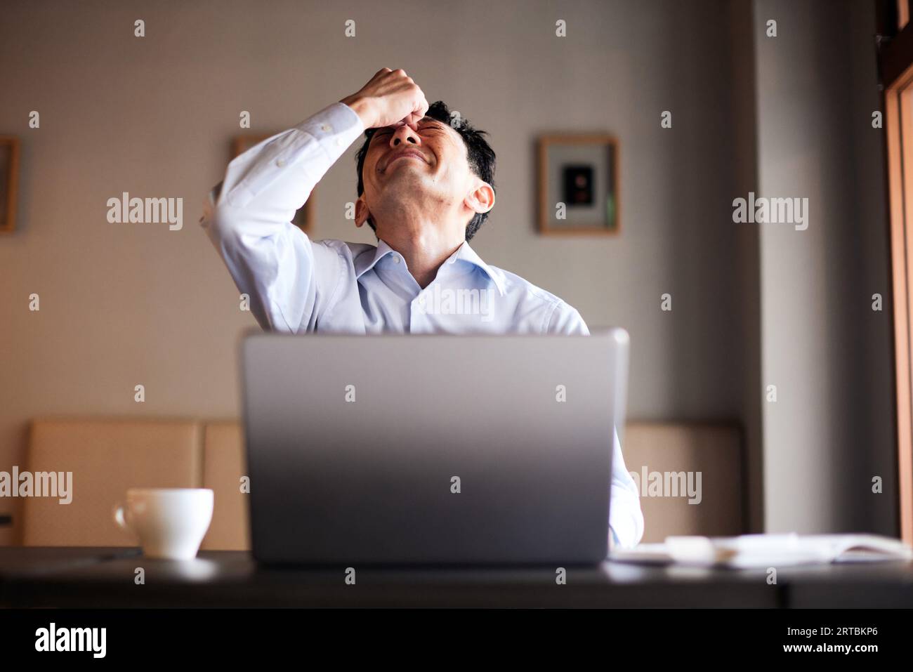Stressed Japanese man Stock Photo - Alamy