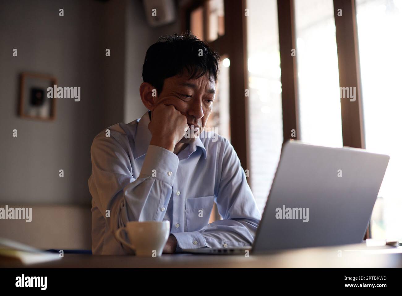 Stressed Japanese man Stock Photo - Alamy