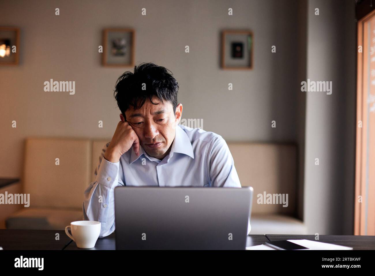 Stressed Japanese man Stock Photo - Alamy