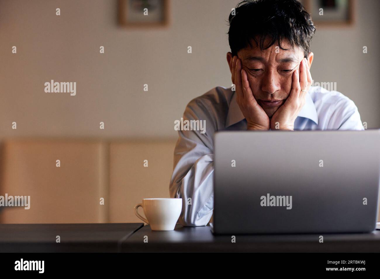 Stressed Japanese man Stock Photo - Alamy