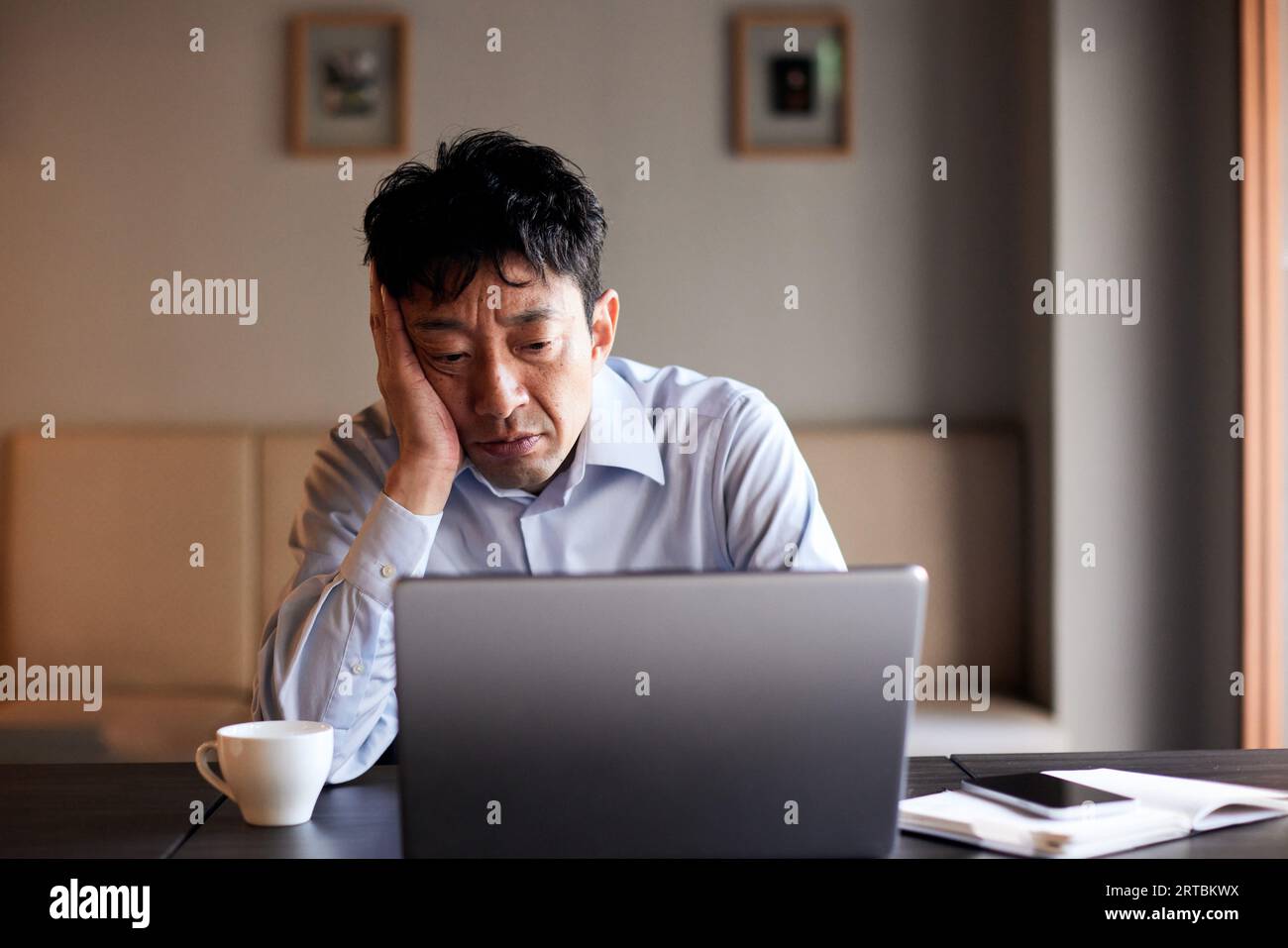 Stressed Japanese man Stock Photo - Alamy