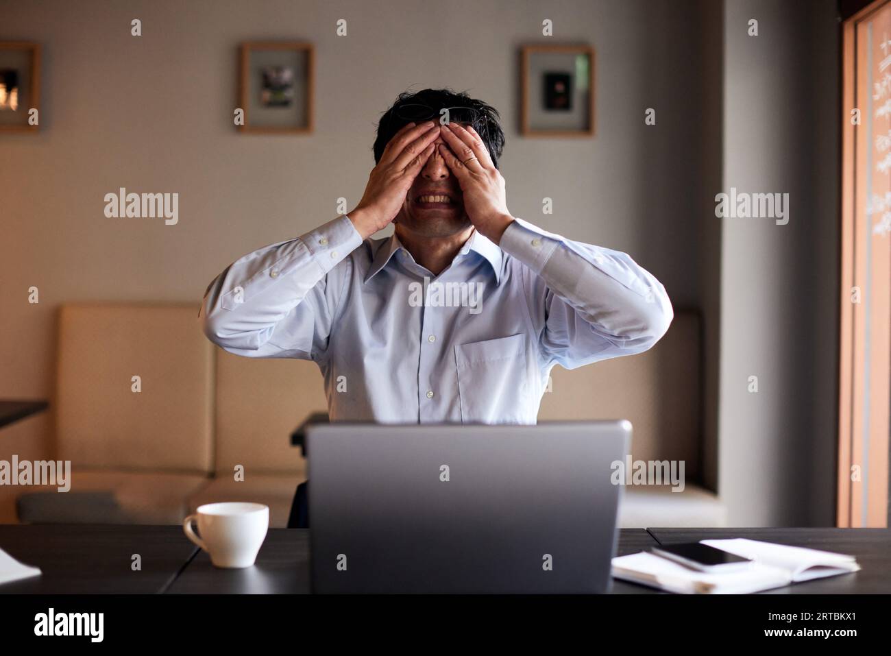 Stressed Japanese man Stock Photo - Alamy