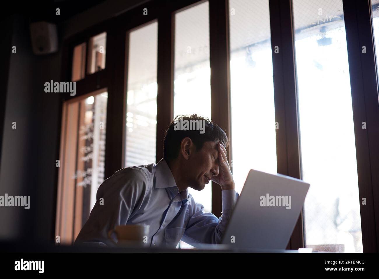 Stressed Japanese man Stock Photo - Alamy