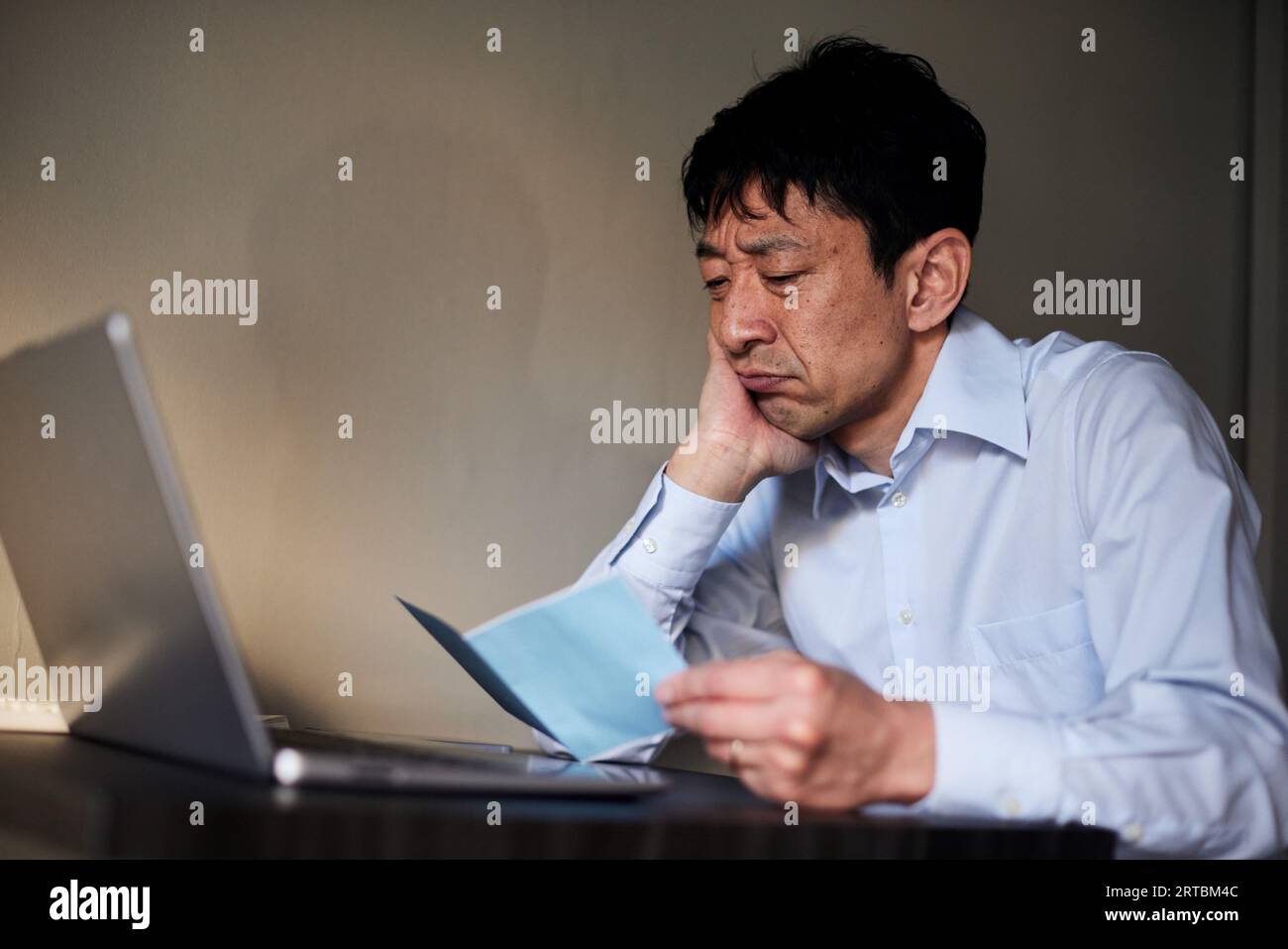 Stressed Japanese man Stock Photo - Alamy