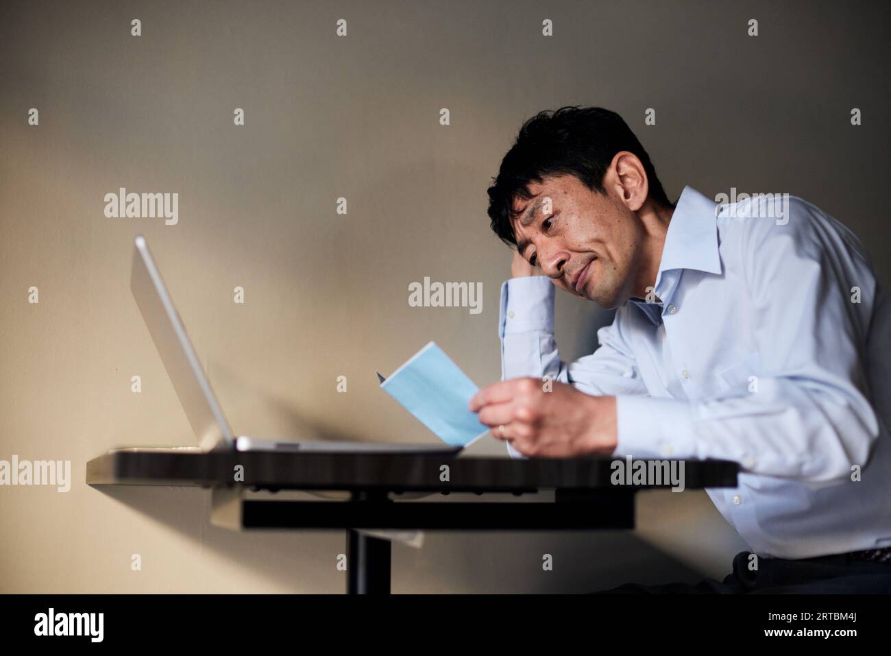 Stressed Japanese man Stock Photo - Alamy