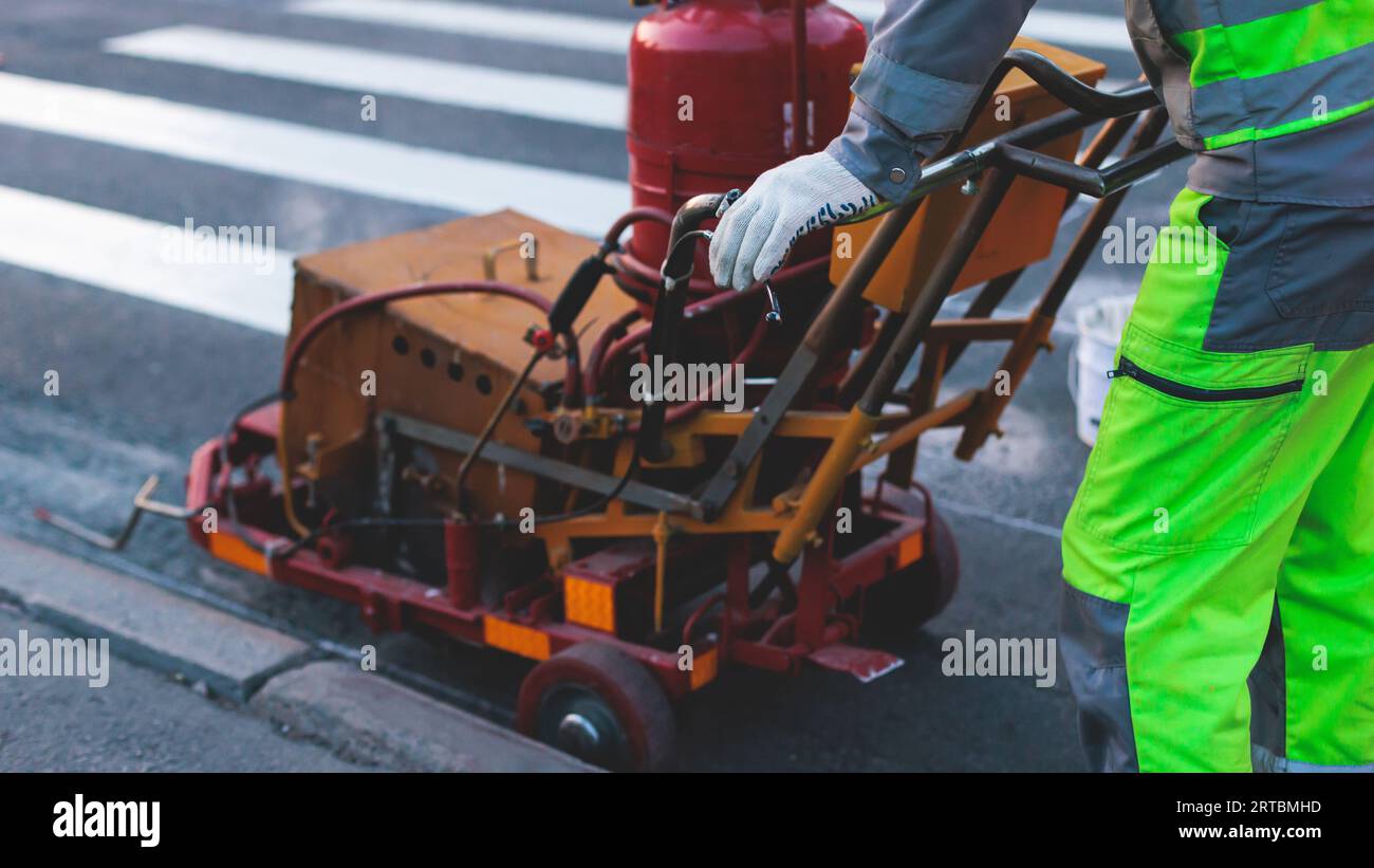 Process of making new road surface markings with a line striping ...