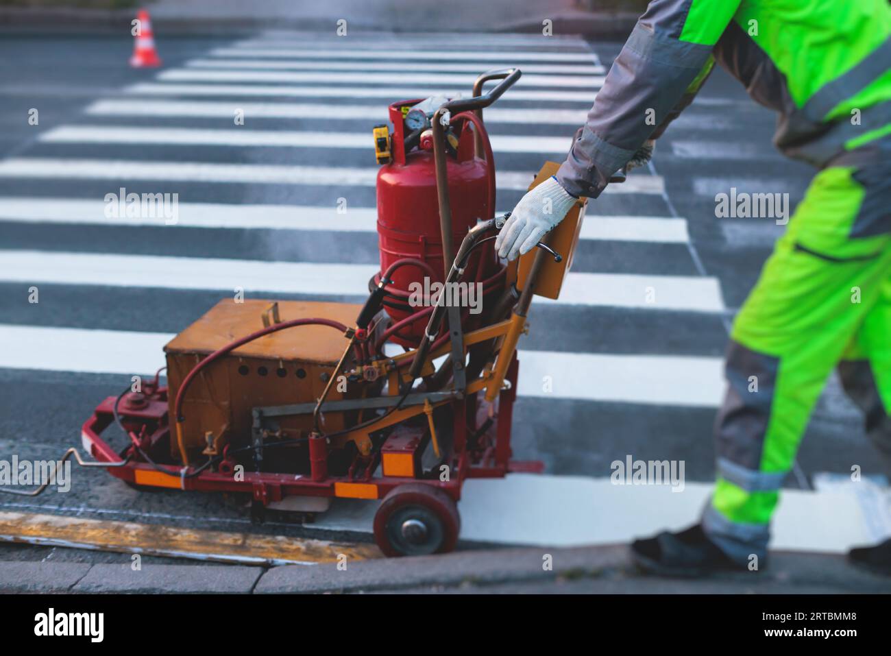 Process of making new road surface markings with a line striping ...