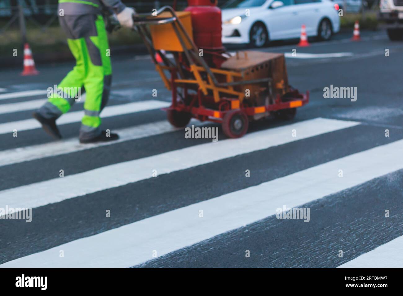 Process of making new road surface markings with a line striping ...