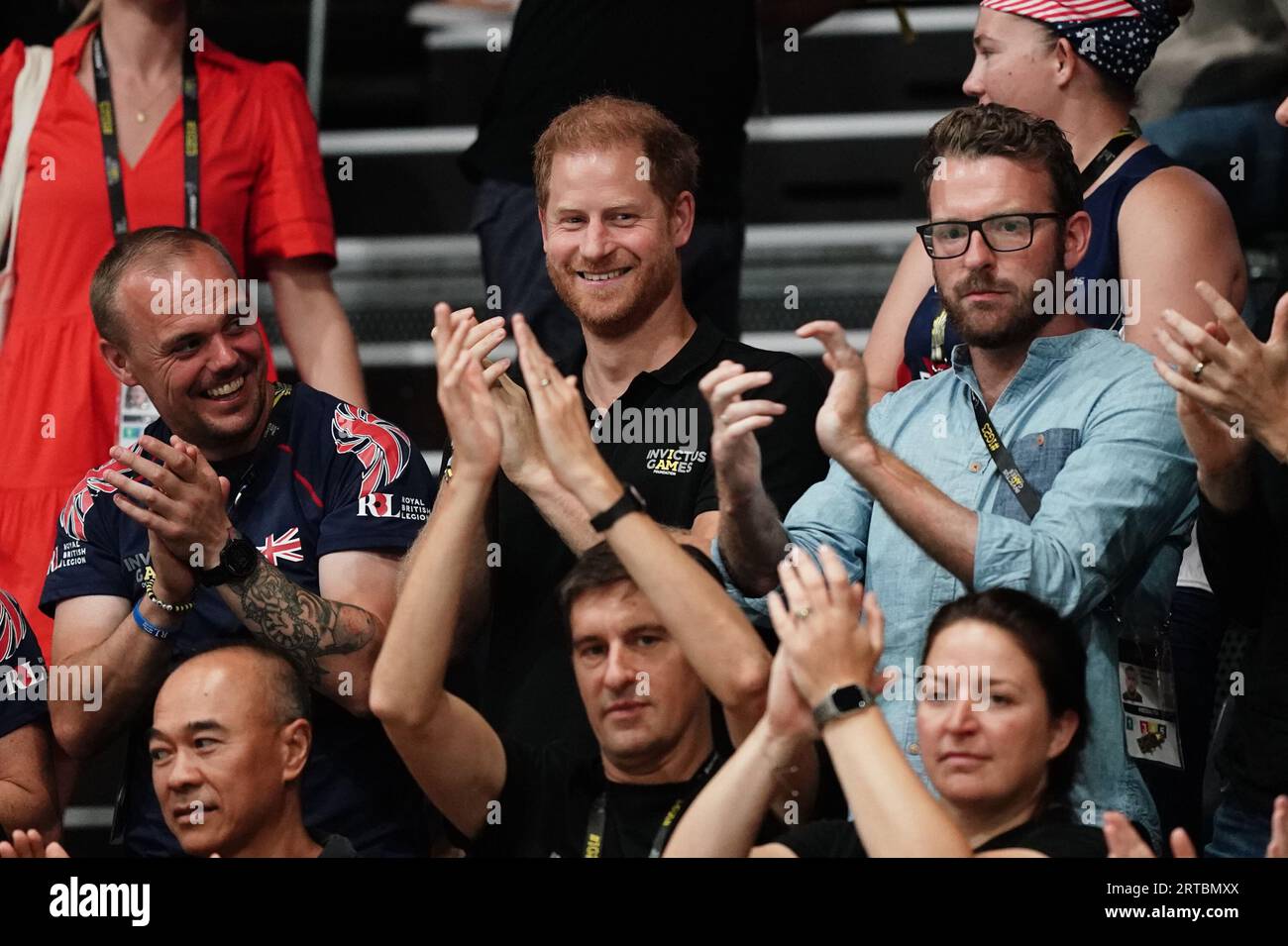 The Duke of Sussex (centre) and JJ Chalmers (right) clap as they watch ...