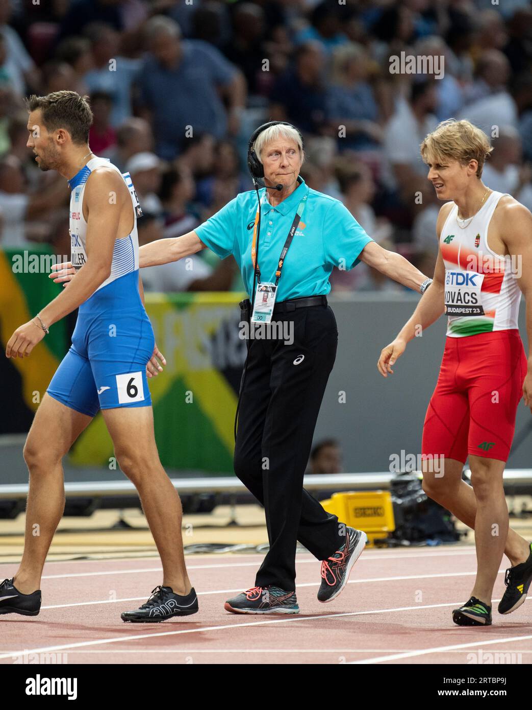Jane Marie Edstrom (Official NTO) helping athletes’ of the track after ...