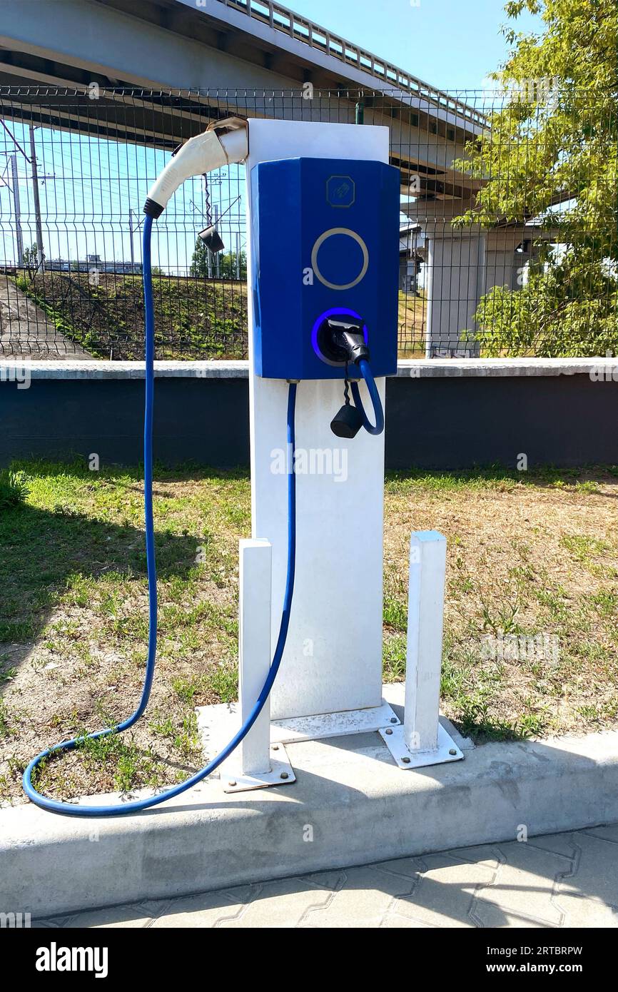 Eco friendly transport concept. Electric charging station in city ...