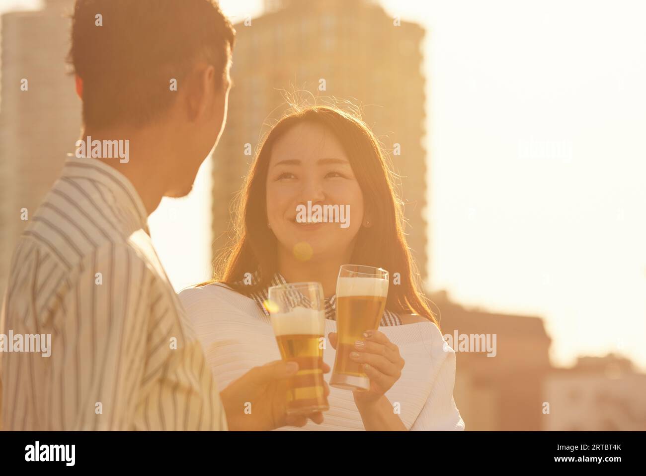 Two people drinking light hi-res stock photography and images - Alamy