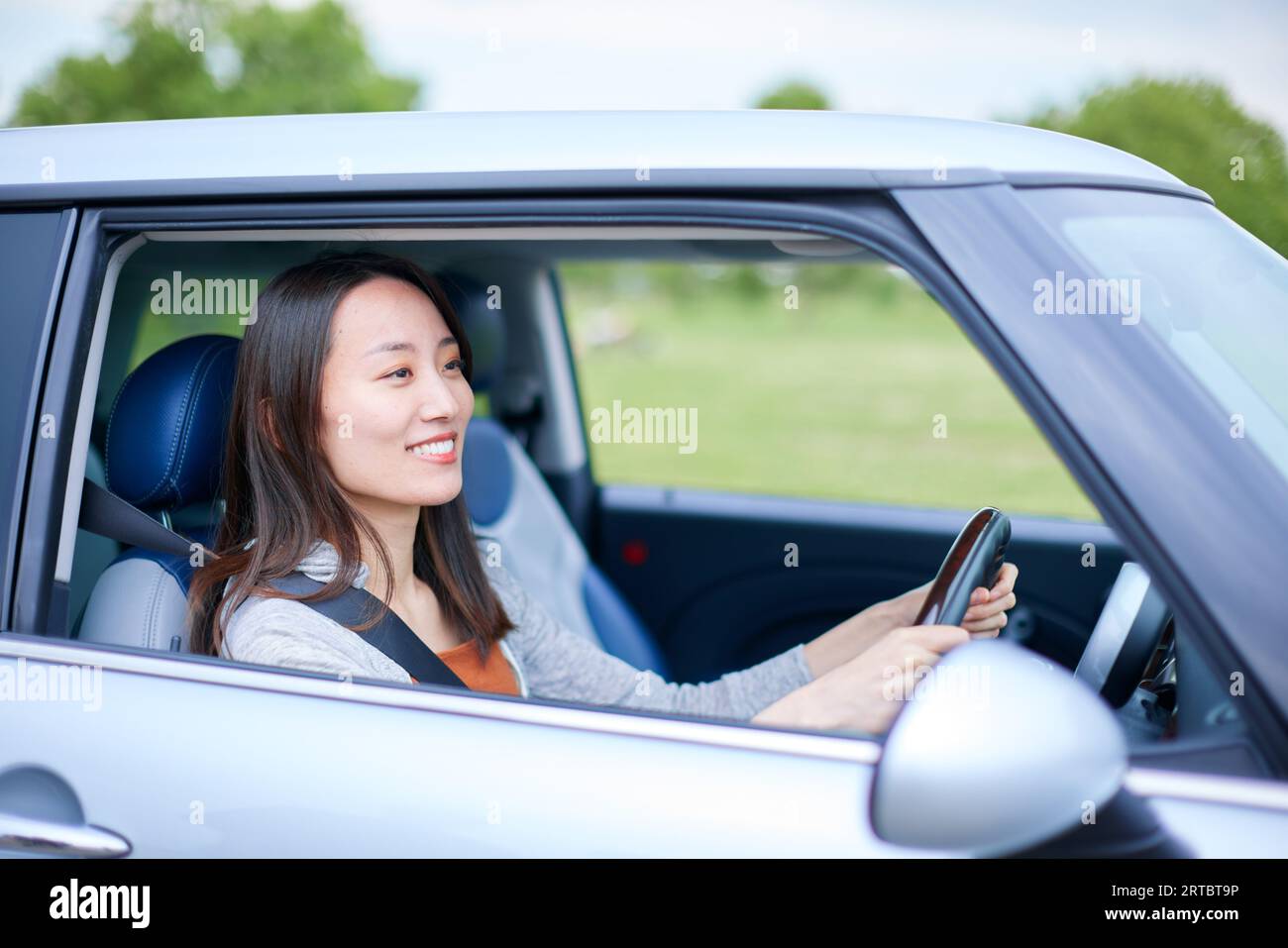 Japanese woman driving Stock Photo - Alamy