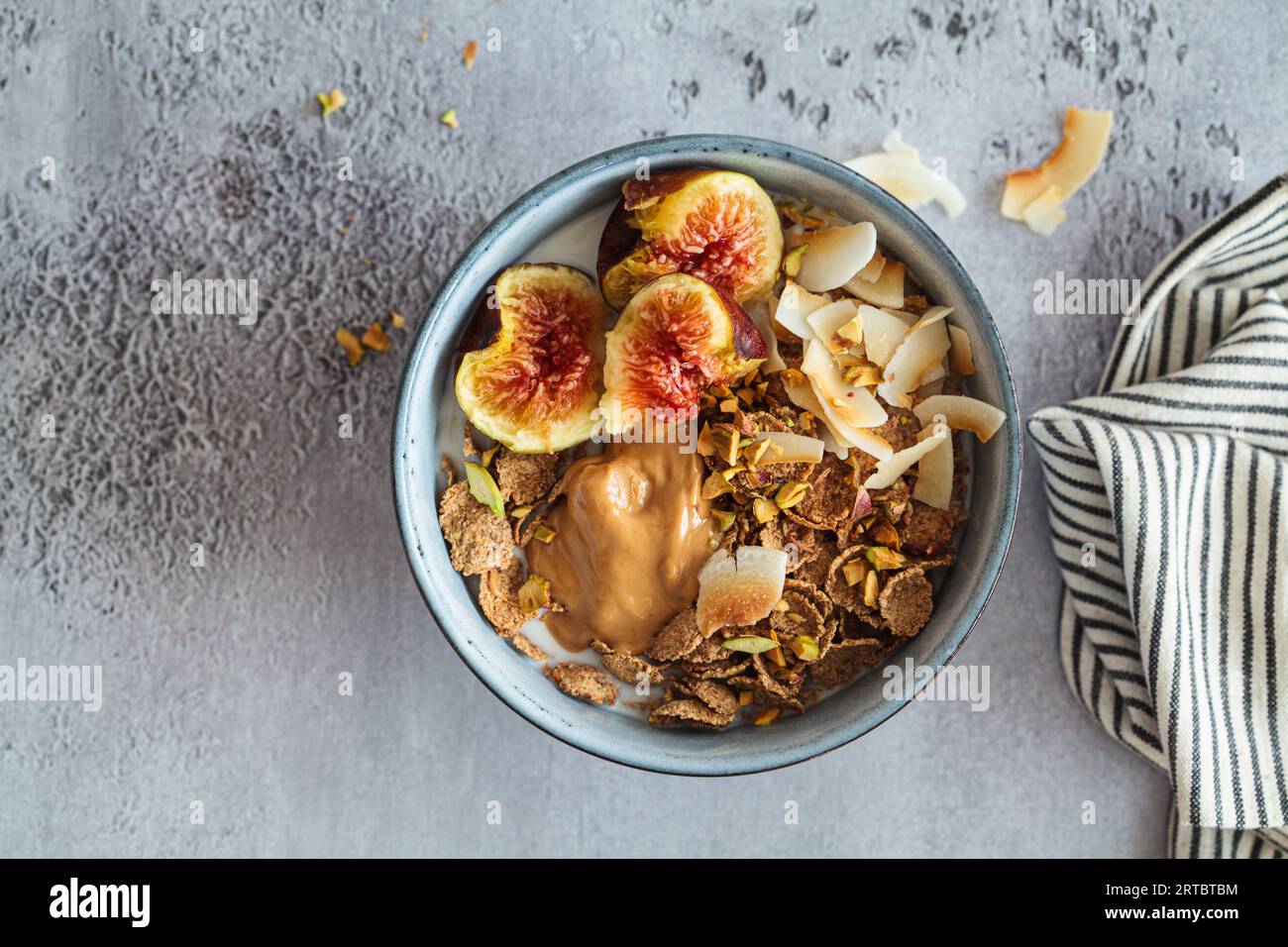 Multigrain wholewheat breakfast cereals with fig, coconut chips, peanut ...