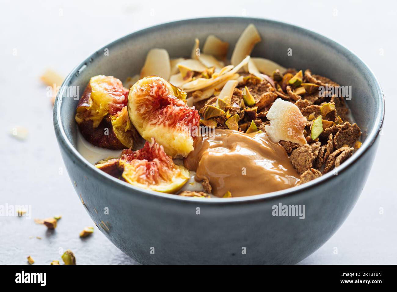 Multigrain wholewheat breakfast cereals with fig, coconut chips, peanut ...