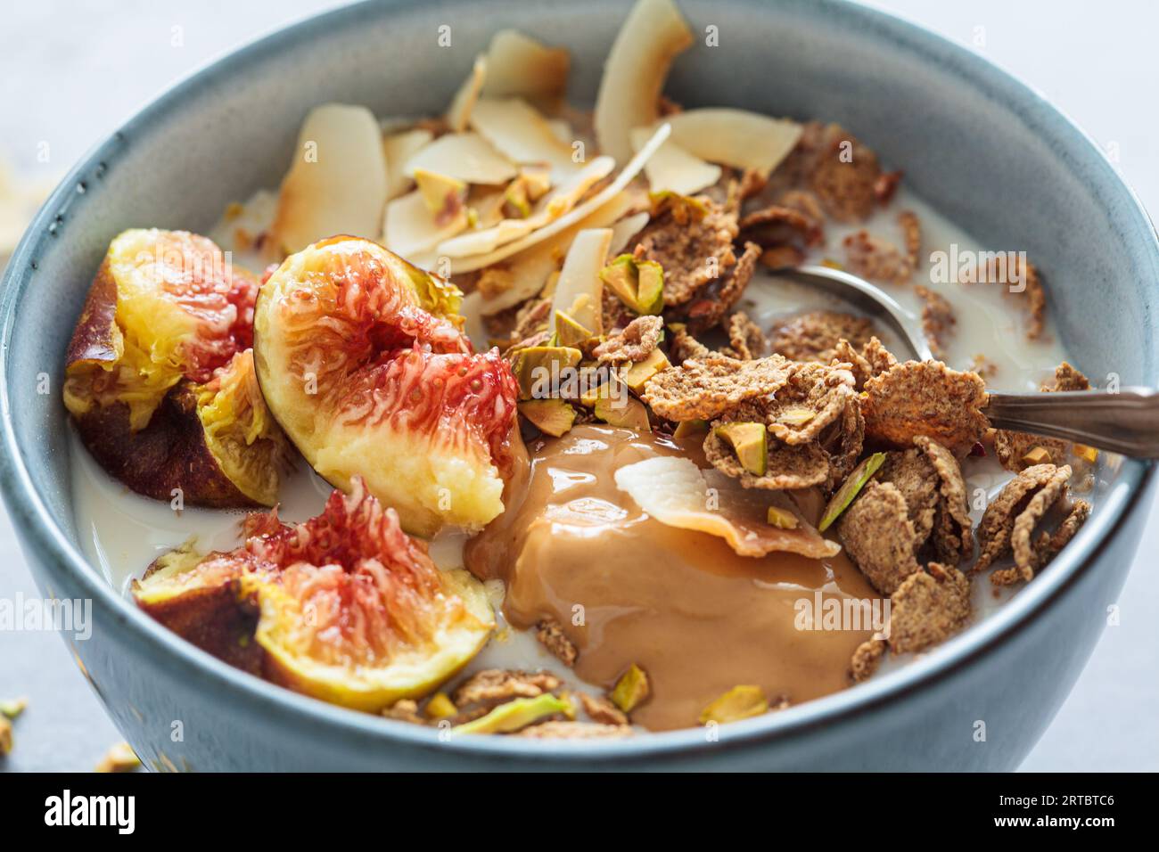 Multigrain wholewheat breakfast cereals with fig, coconut chips, peanut ...