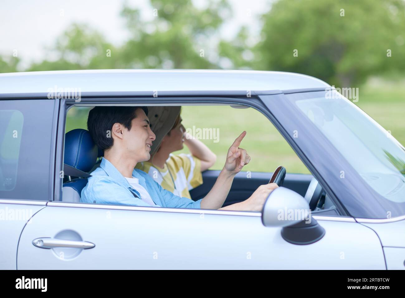 Japanese men driving Stock Photo - Alamy