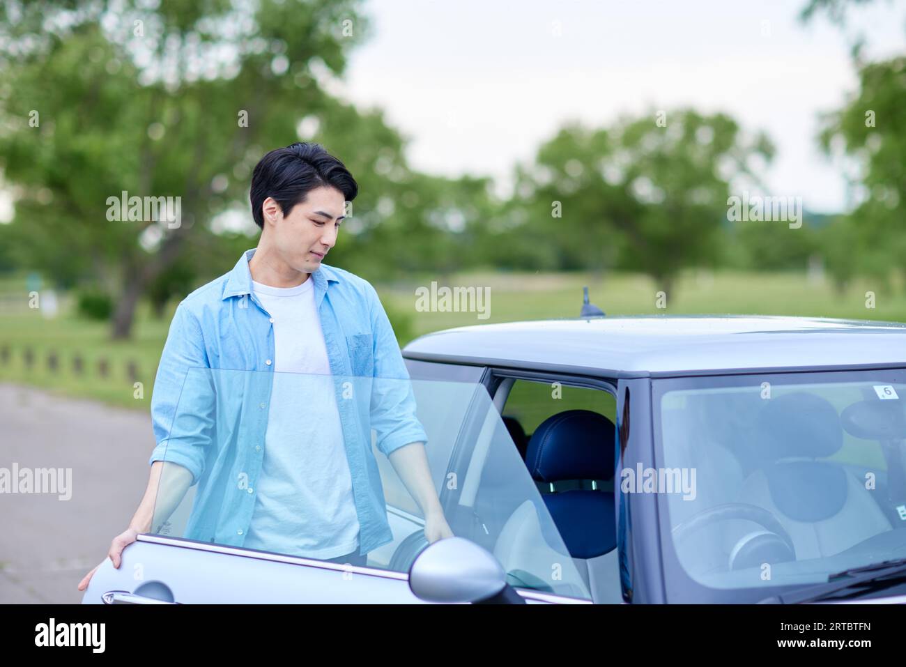 Asian male drive car hi-res stock photography and images - Alamy