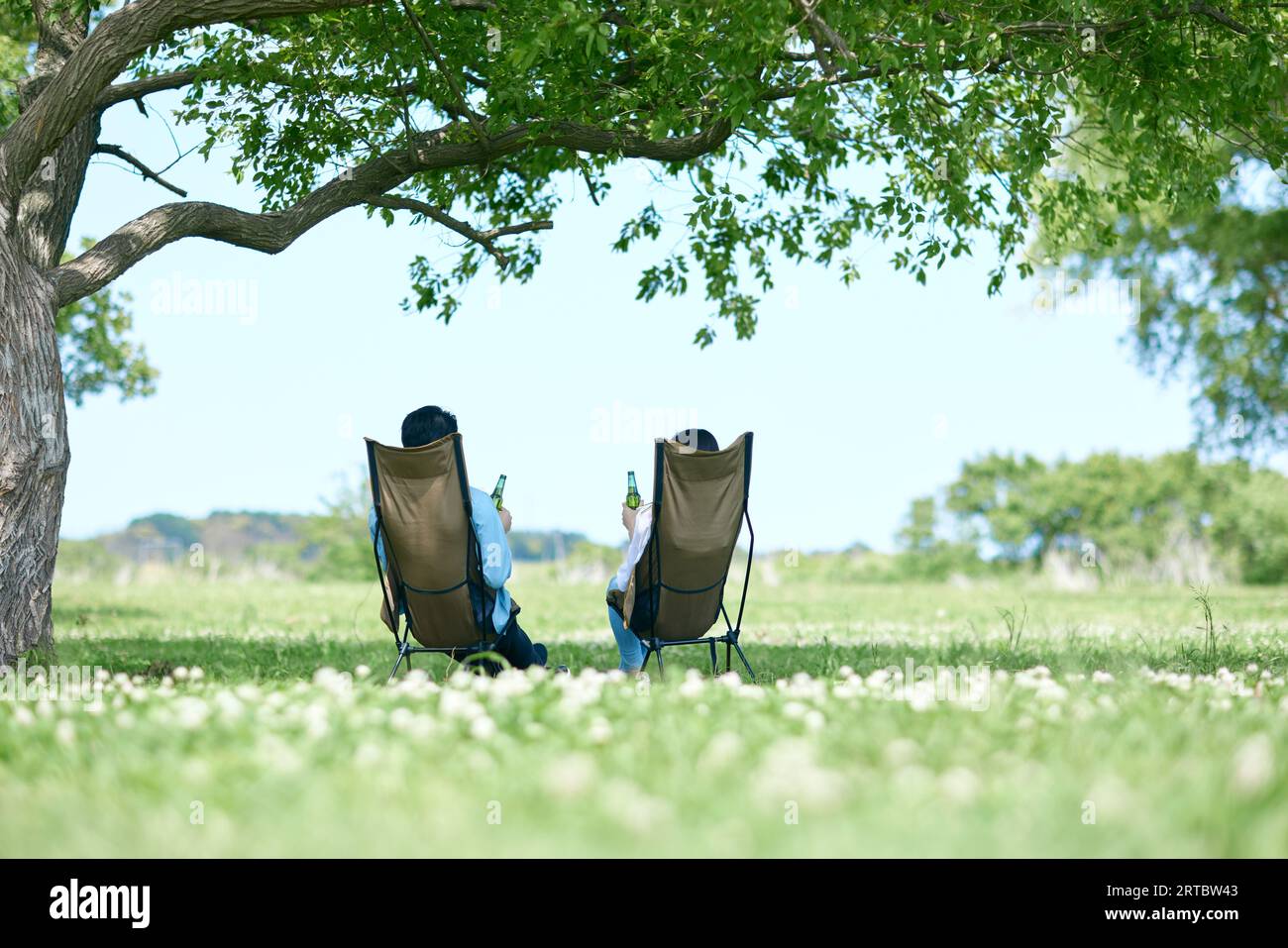 Japanese people relaxing at city park Stock Photo - Alamy
