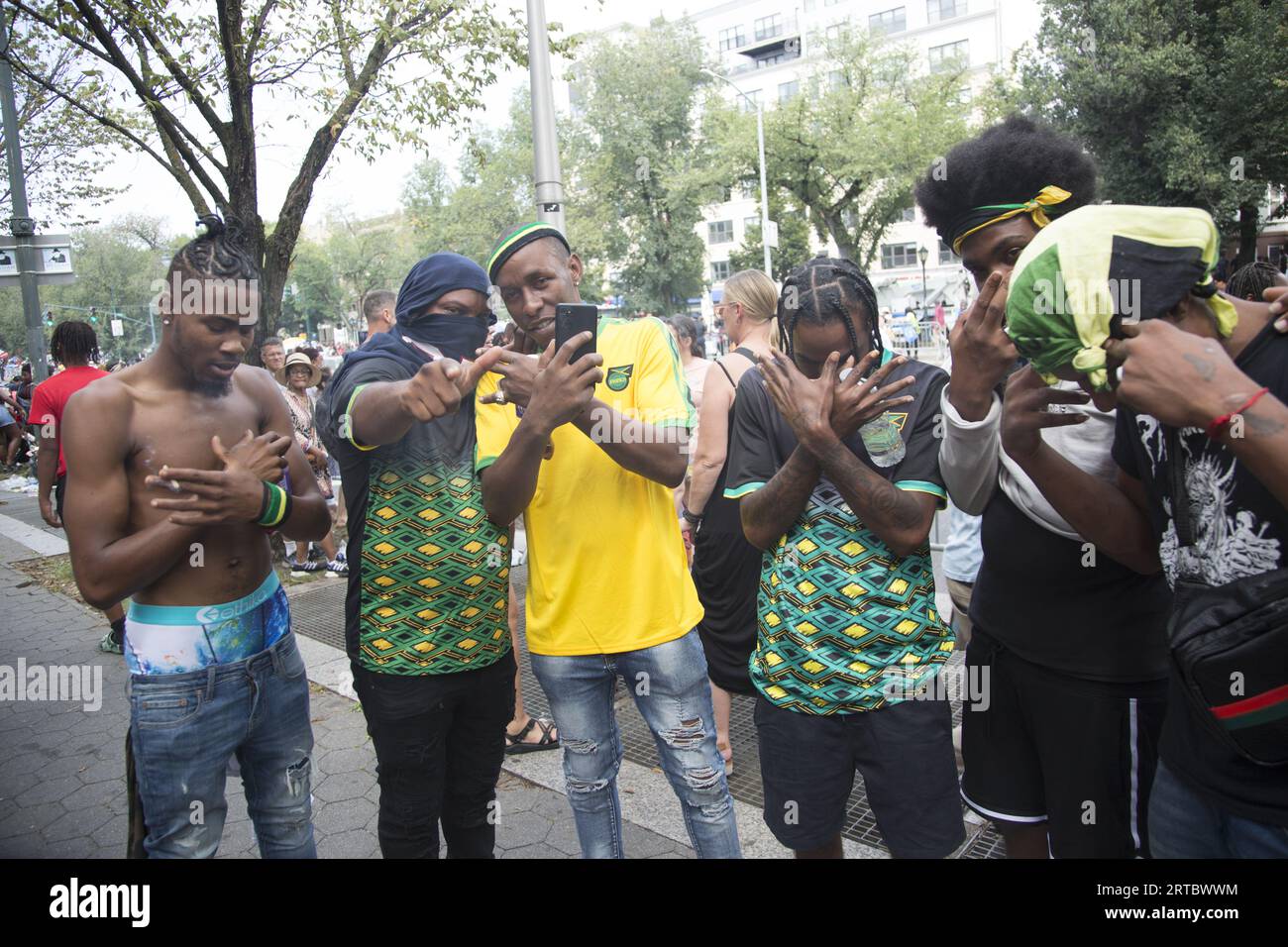 Crew of young men cruzing about at the parade. Spectators along Eastern ...