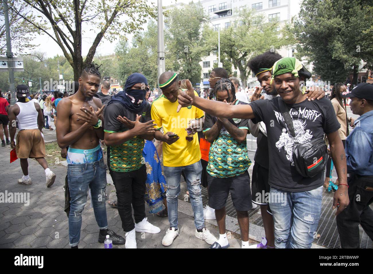 Crew of young men cruzing about at the parade. Spectators along Eastern ...