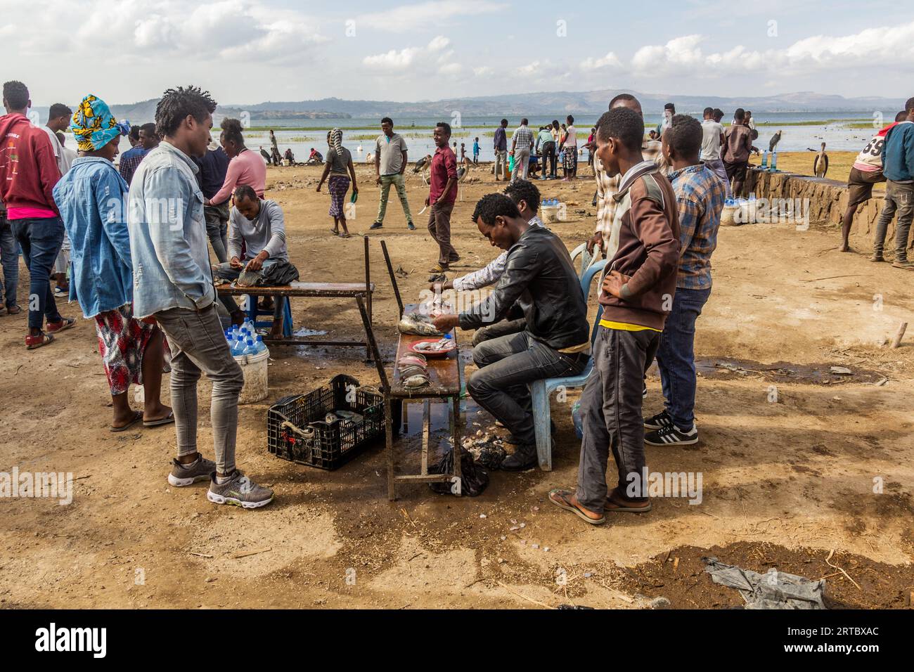 HAWASSA, ETHIOPIA - JANUARY 28, 2020: Local people and fishermen with ...