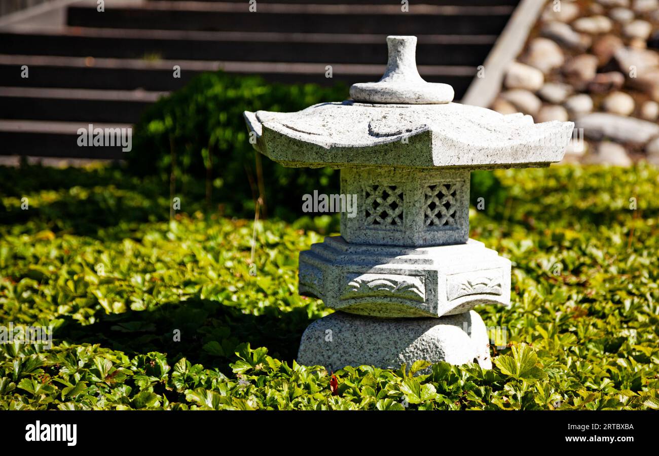 a small pagoda as a garden decoration Stock Photo - Alamy