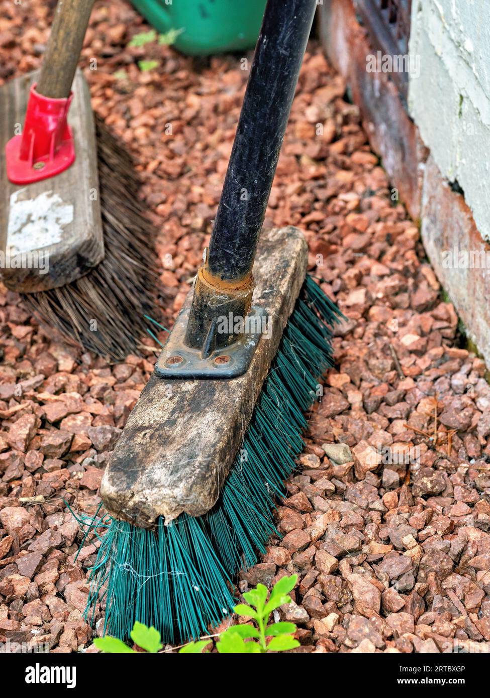 two yard brushes closeup of the broom heads Stock Photo - Alamy