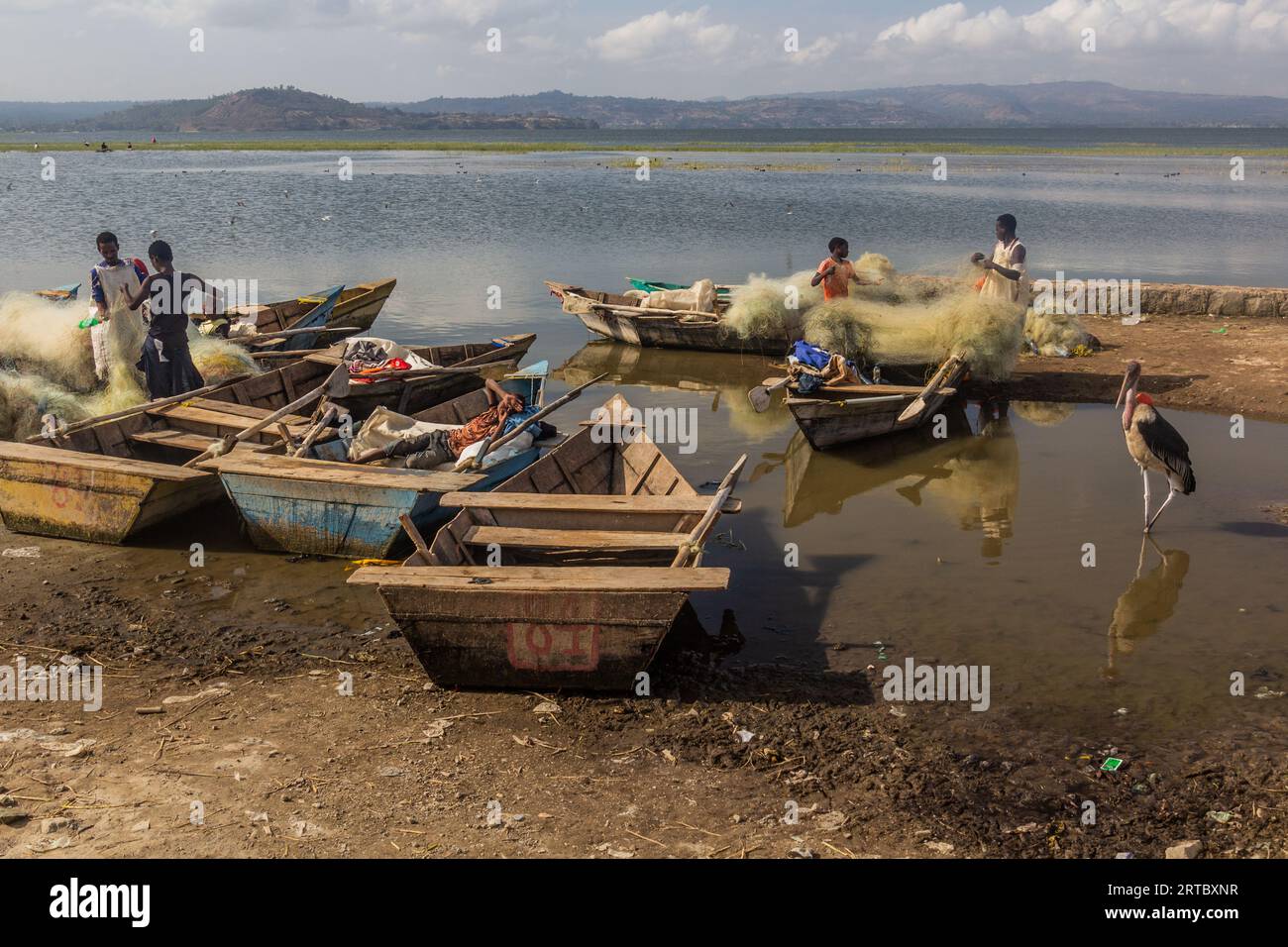 HAWASSA, ETHIOPIA - JANUARY 28, 2020: Fishing boats and nets at the ...