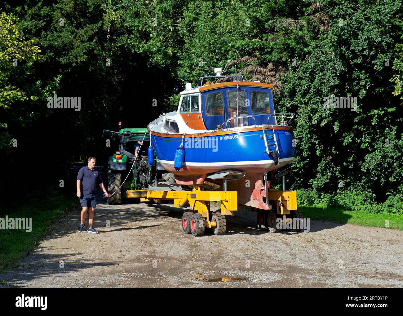 Boat being launched, by tractor, onto the River Ouse, at Acaster Maine ...