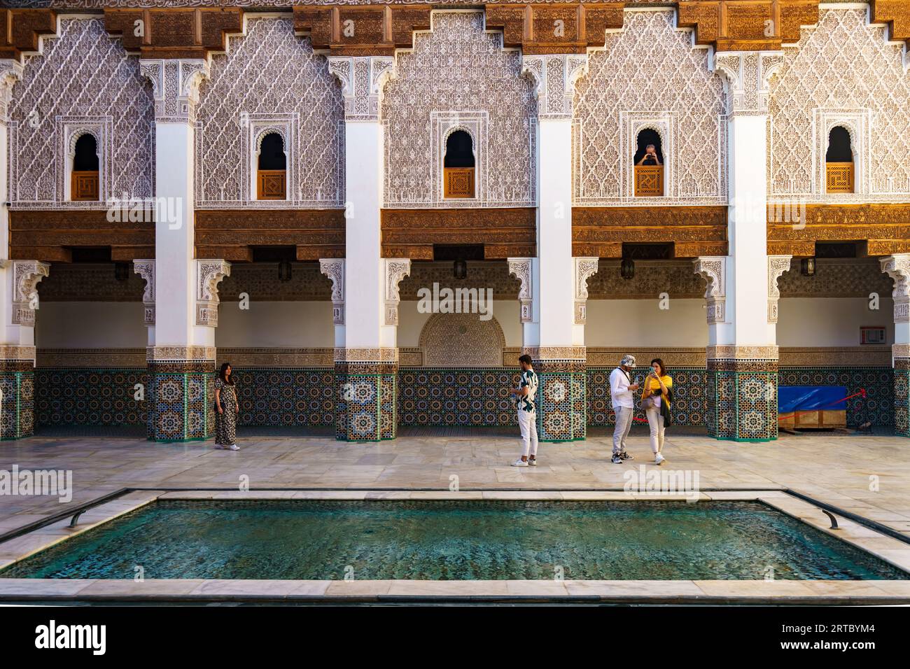 North Africa. Morocco. Marrakesh. Tourists at Madrasa Ben Youssef. The ...