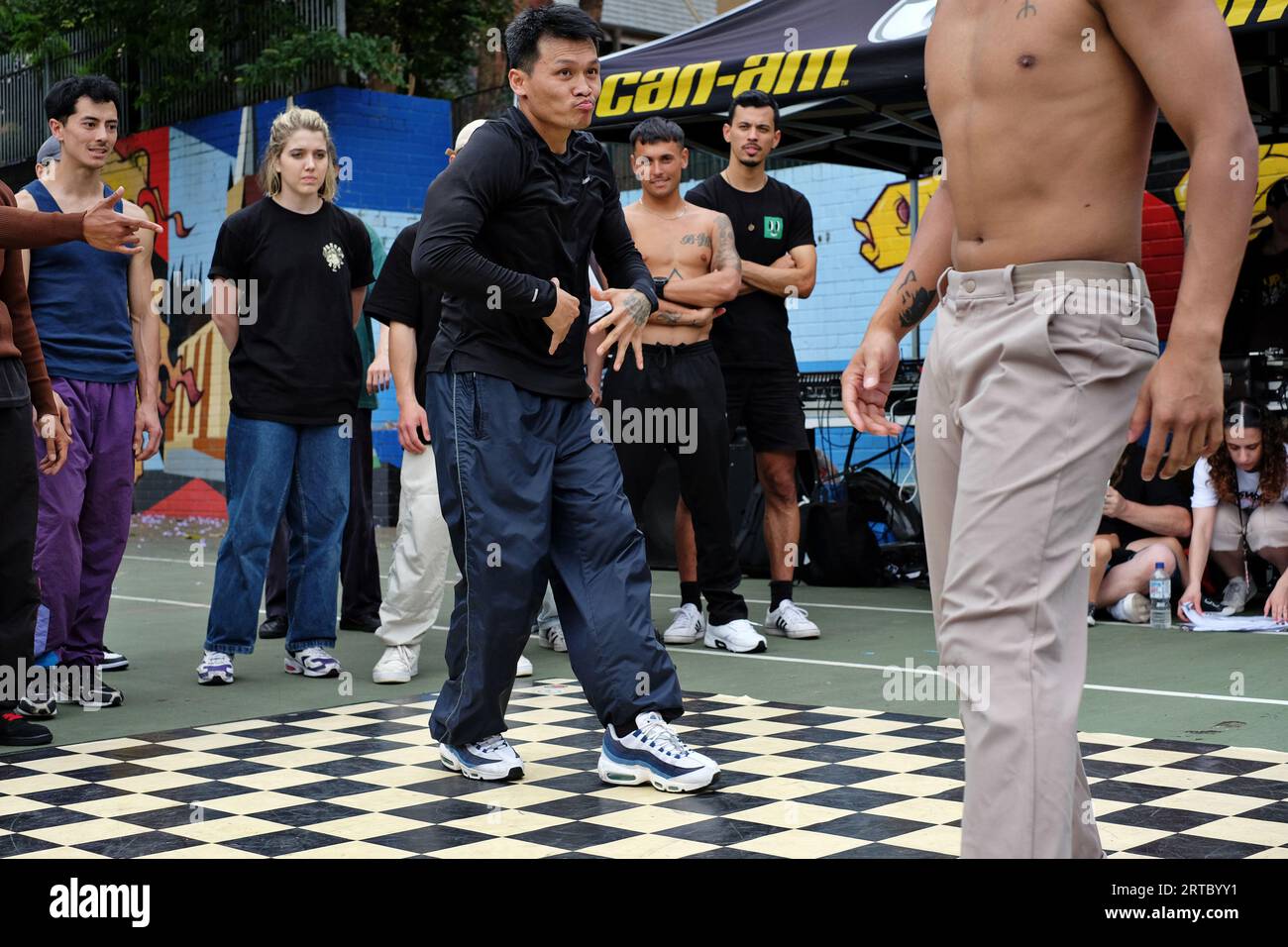 Two male BBoy dancers face off at a breakdancing battle competition ...