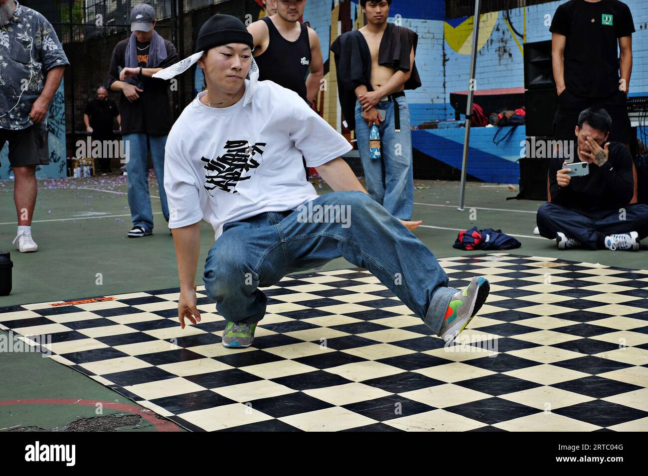 Asian male breakdancer Step, beanie, white tee, blue jeans, battles on ...