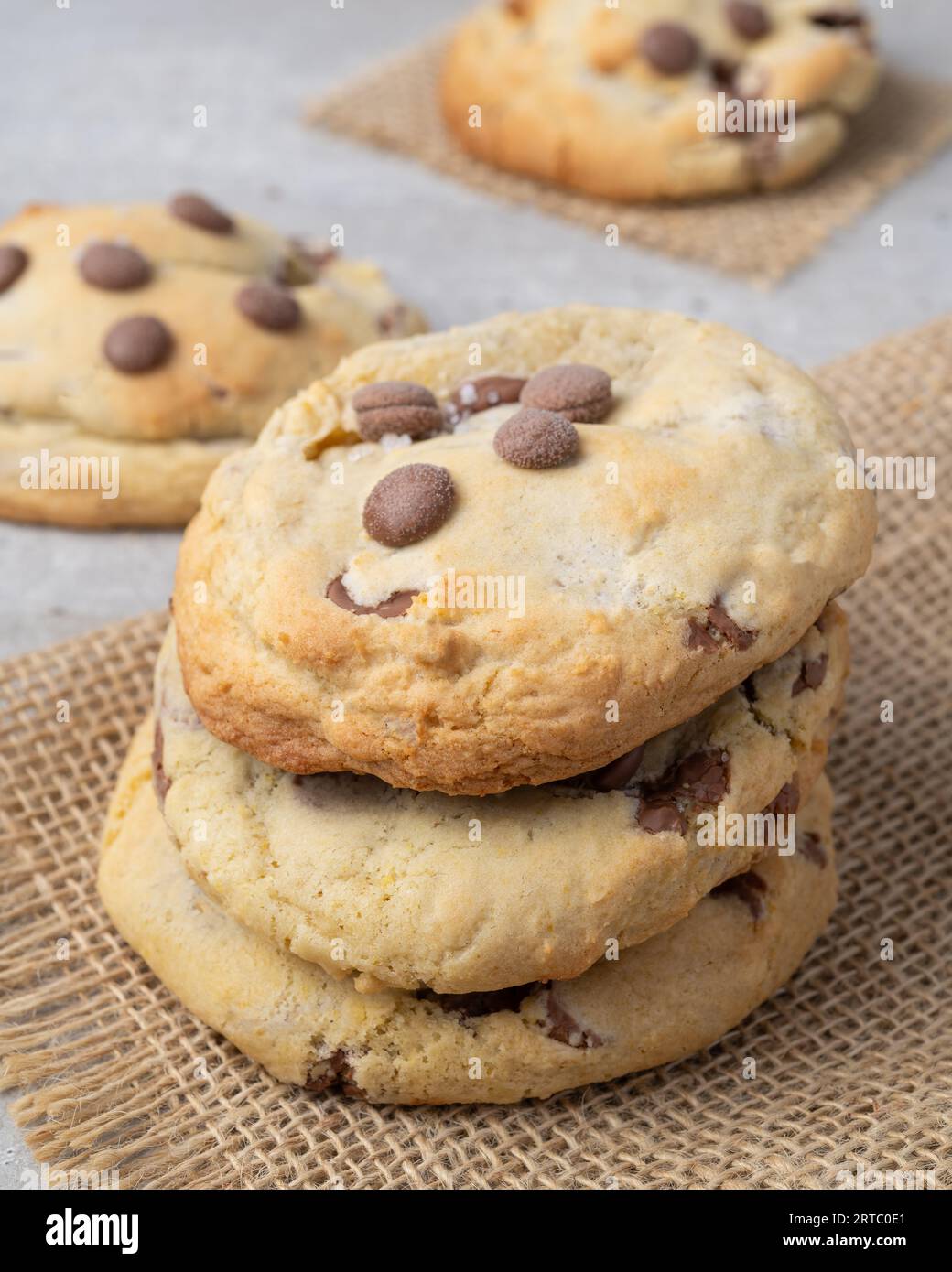 Chocolate chip cookies stacked over rustic fabric Stock Photo - Alamy