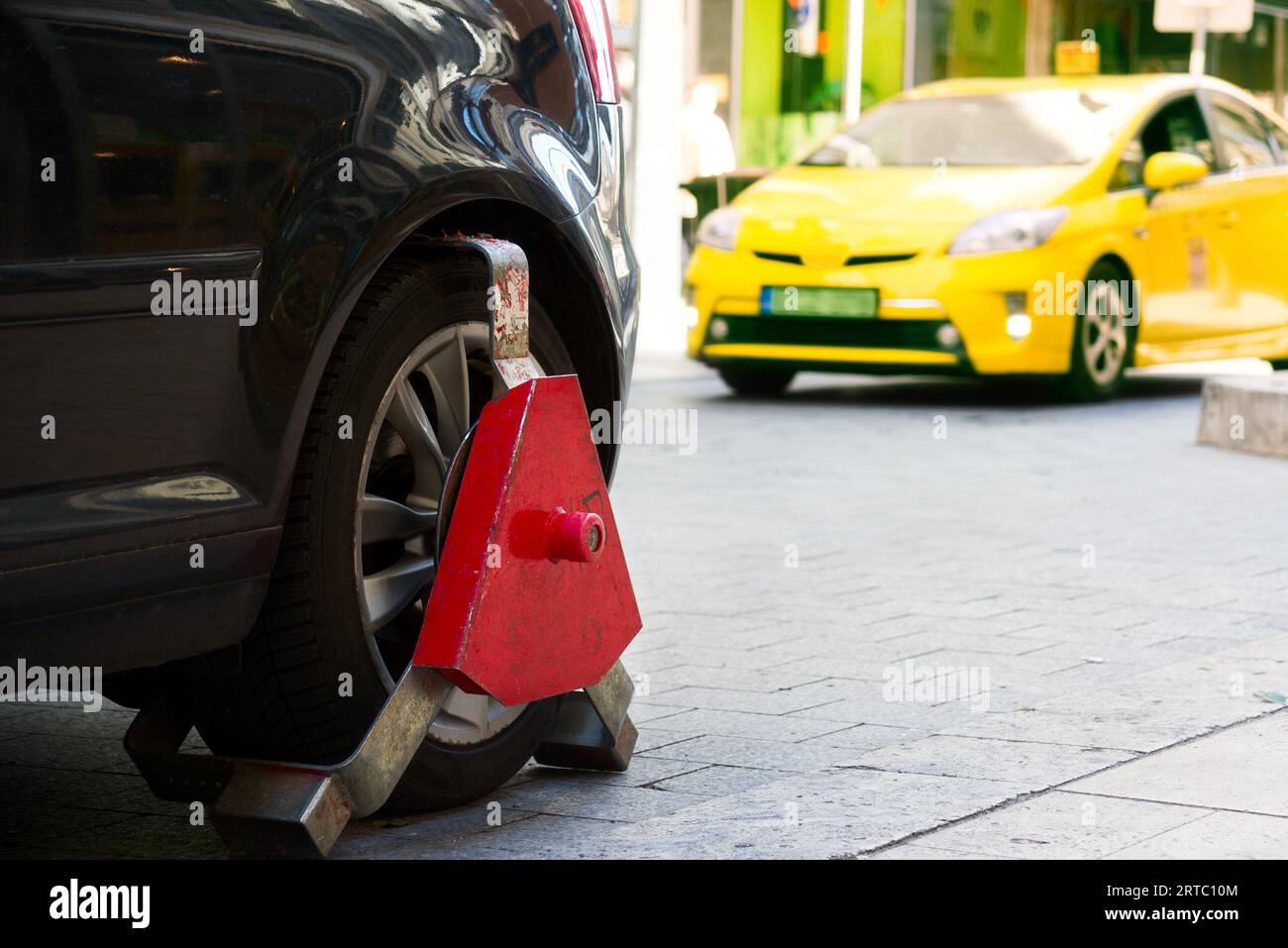 Blocker on a car wheel on the street Stock Photo - Alamy